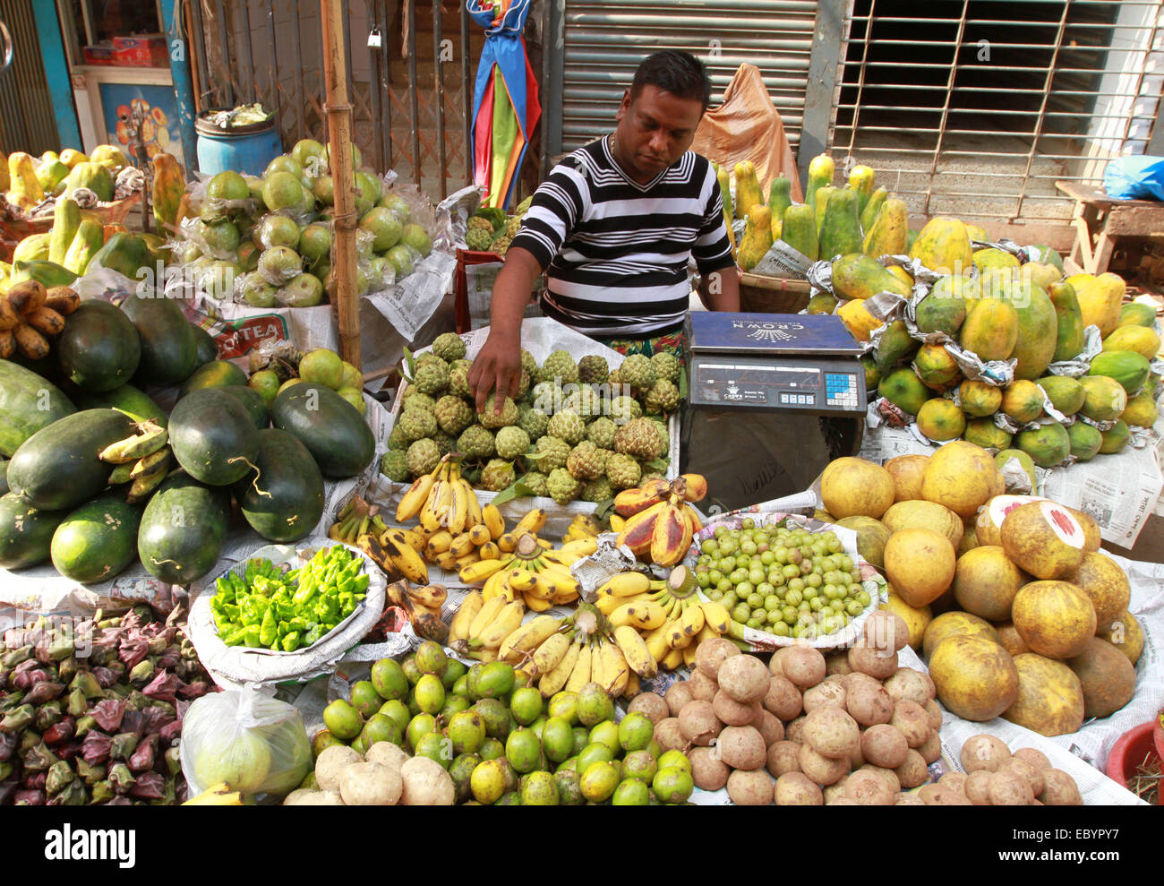 Dhaka 05 December 2014. Fruit vendor at Chwak Bazar in Old Dhaka, The capital city of Bangladesh ...