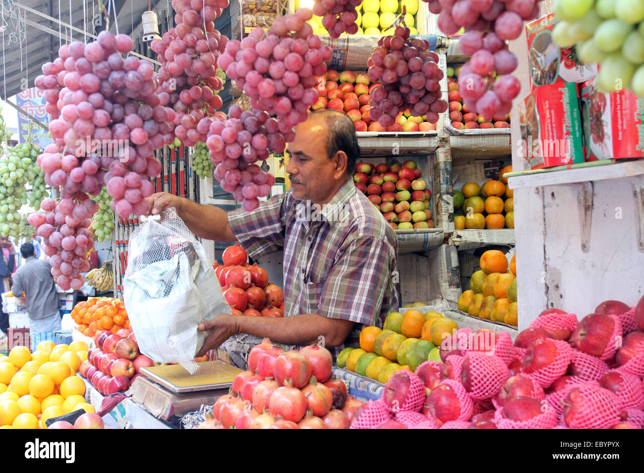 Dhaka 05 December 2014. Fruit vendor at Chwak Bazar in Old Dhaka, The capital city of Bangladesh ...