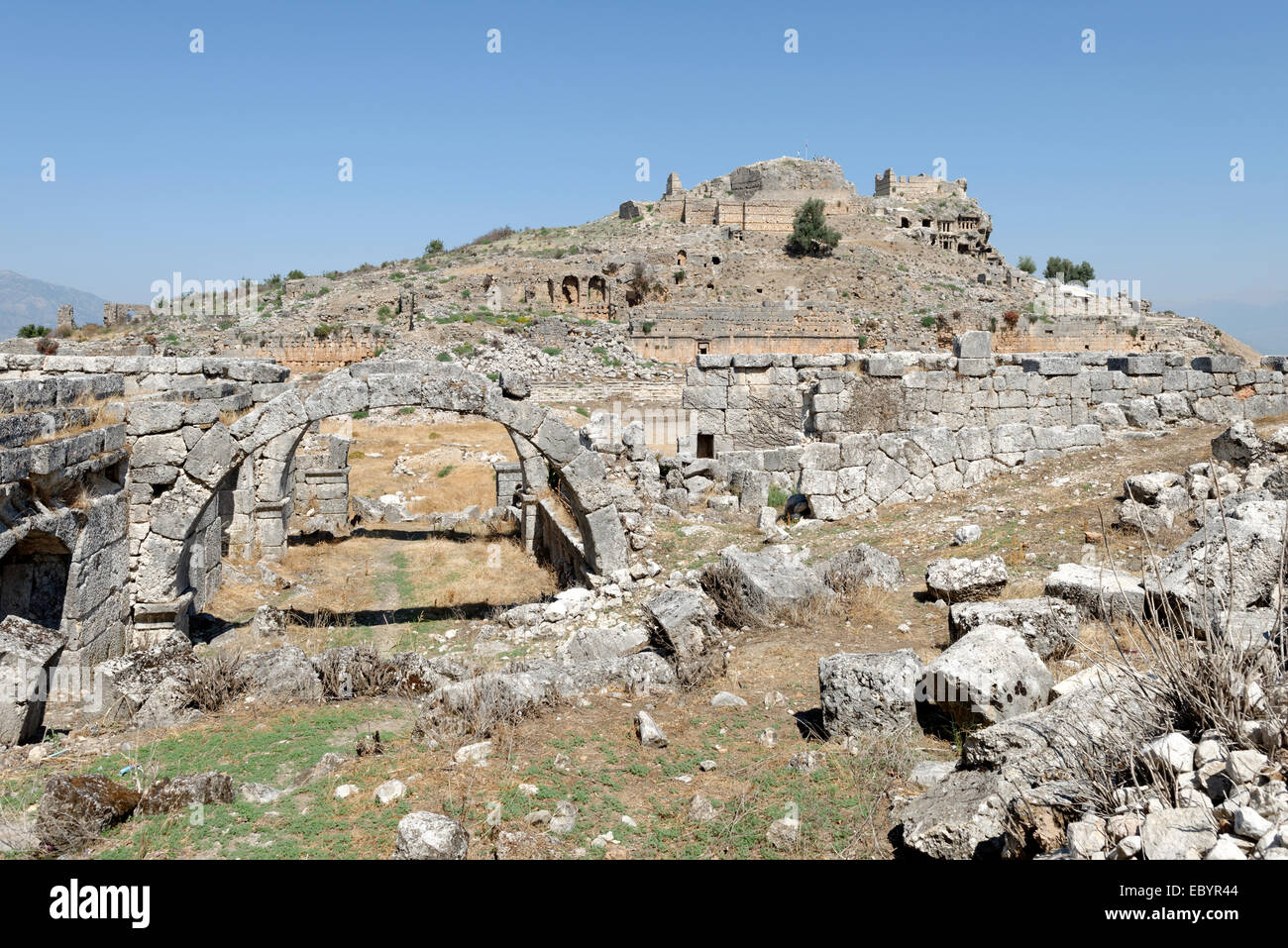 Vaulted arched walkway to the stadium from the agora. Acropolis is in ...