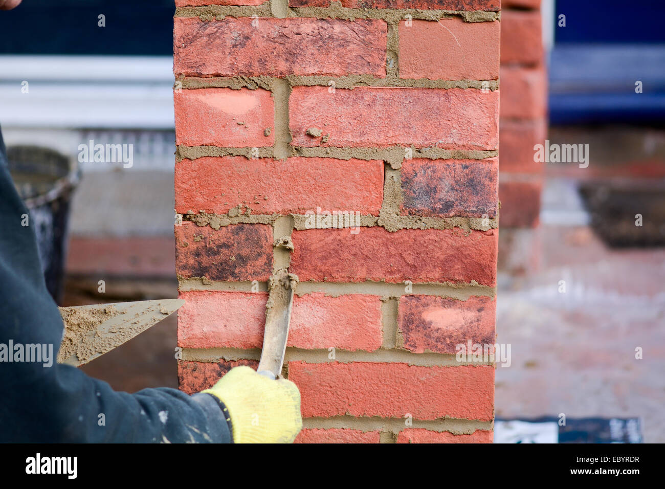 Bricklaying pointing a wall Stock Photo - Alamy
