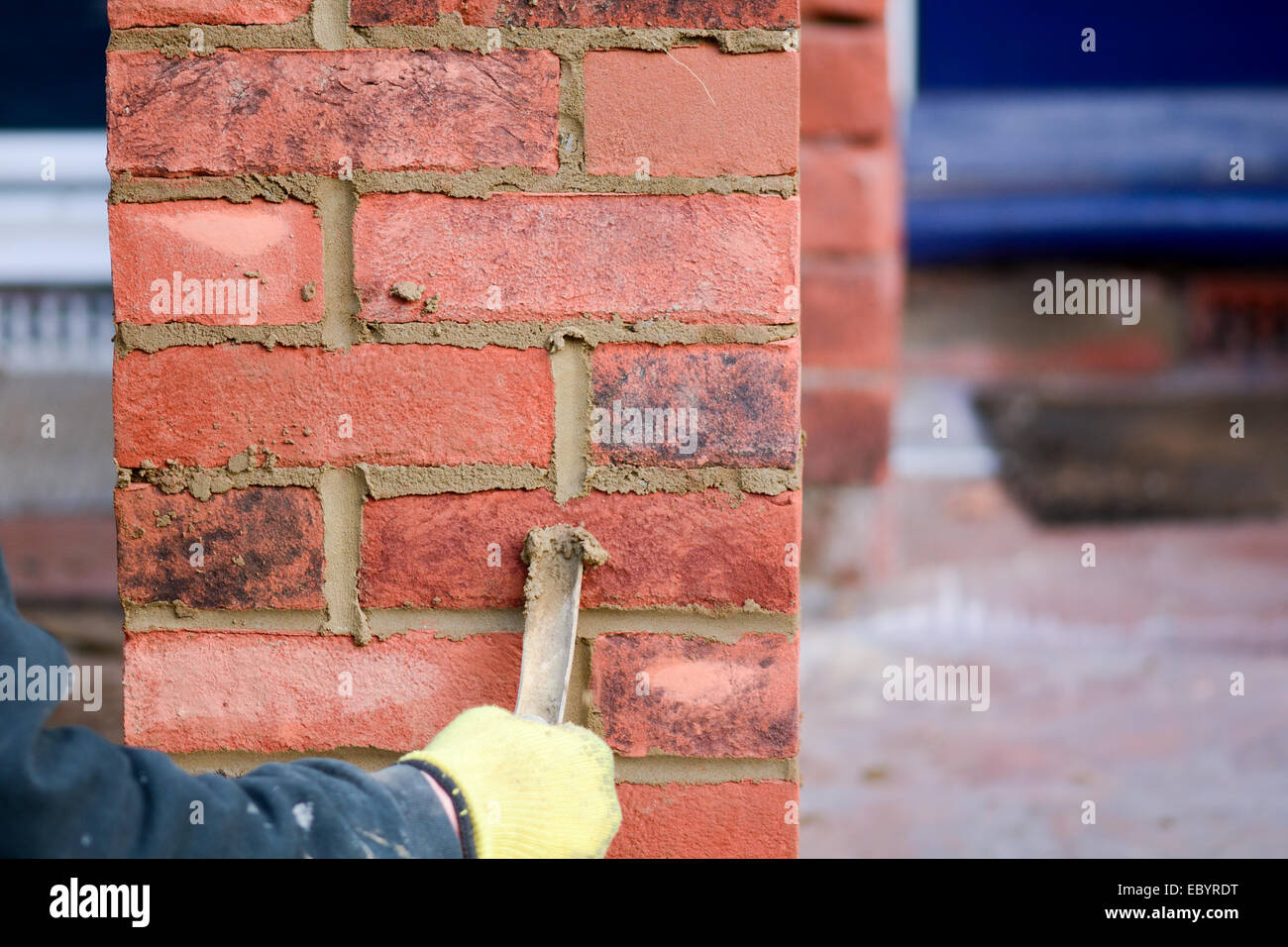 Bricklaying pointing a wall Stock Photo - Alamy