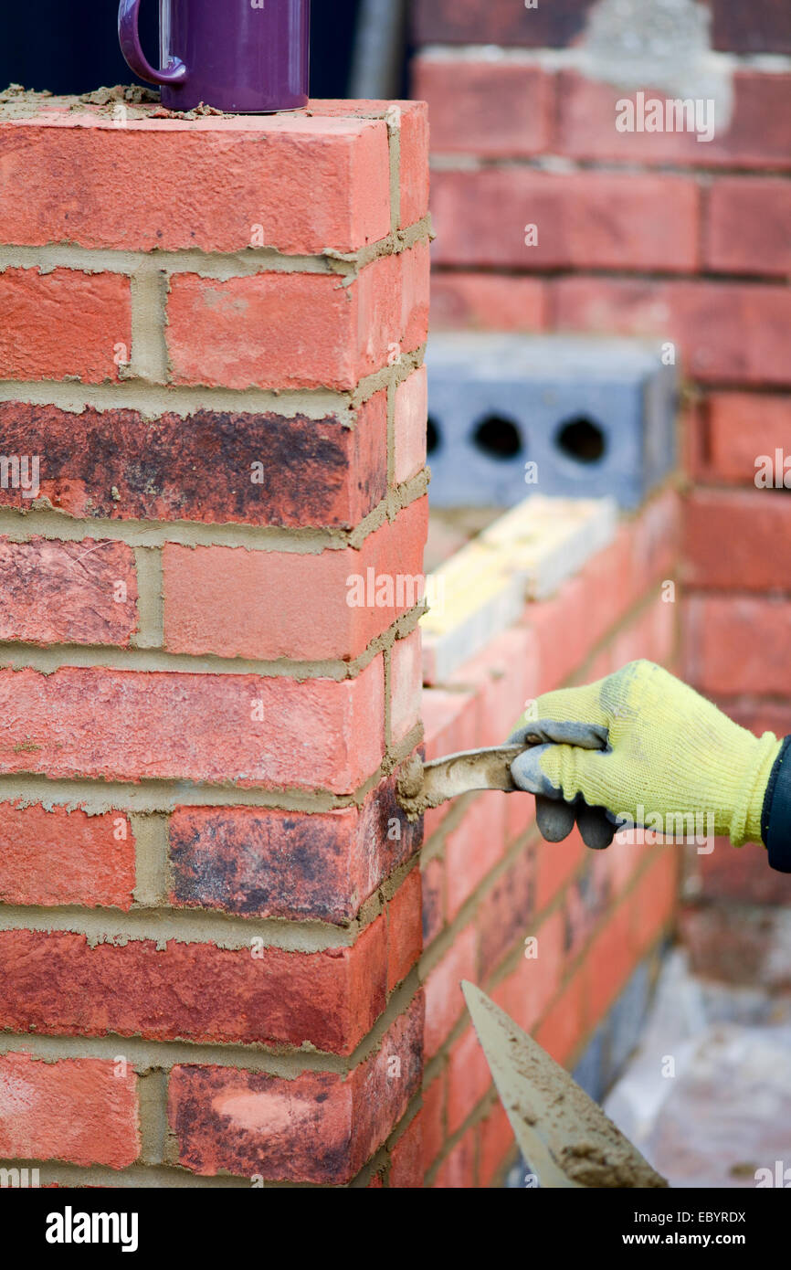 Bricklaying pointing a wall Stock Photo - Alamy