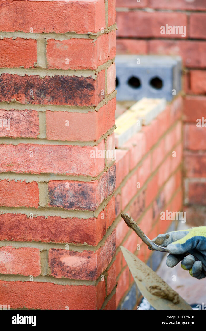 Bricklaying pointing a wall Stock Photo - Alamy