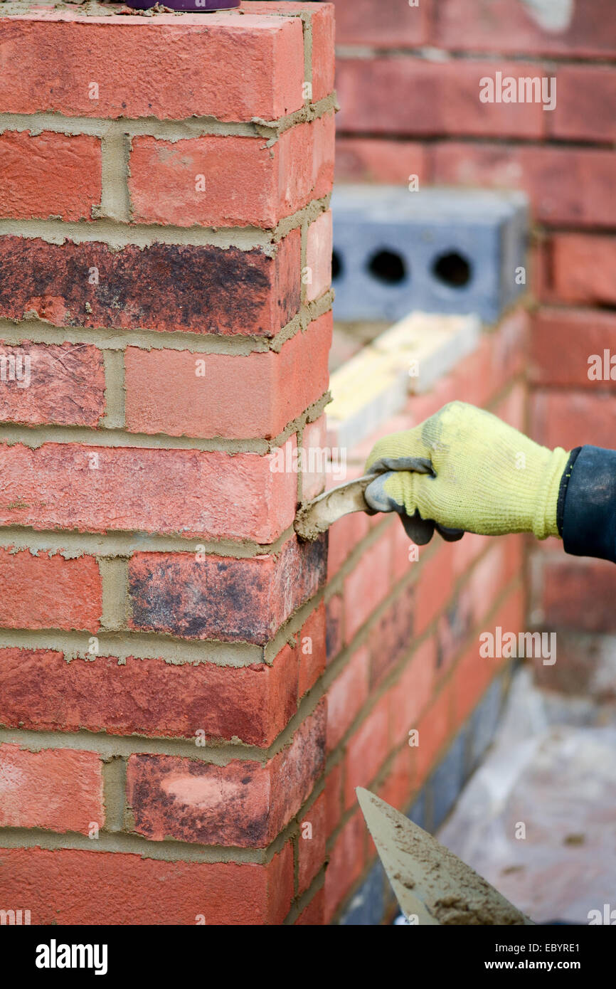 Bricklaying pointing a wall Stock Photo - Alamy