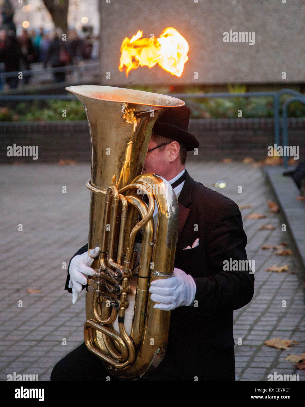 Busker in London playing musical instrument blowing fire Stock Photo ...