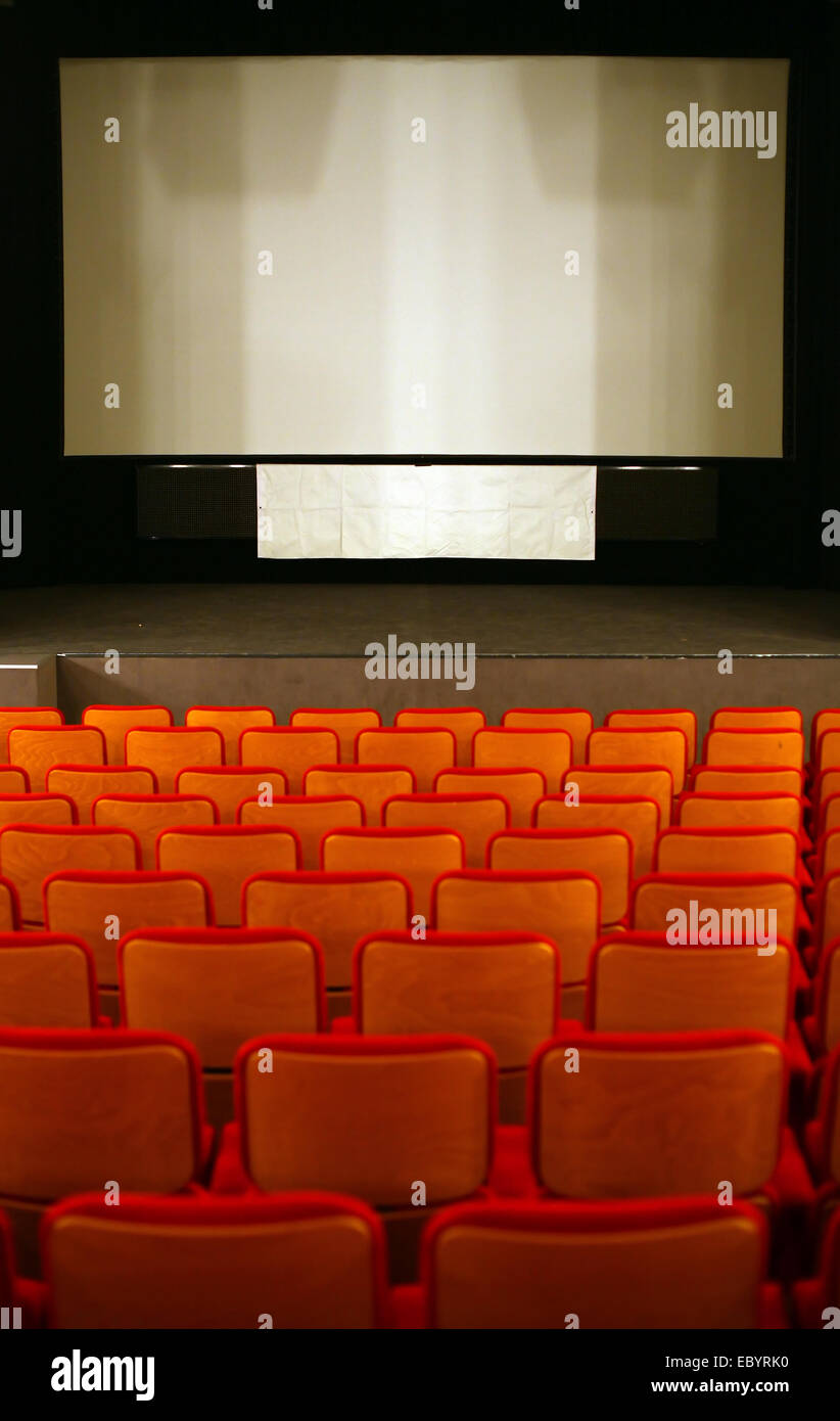 Color vertical shot of some seats in a cinema hall Stock Photo - Alamy