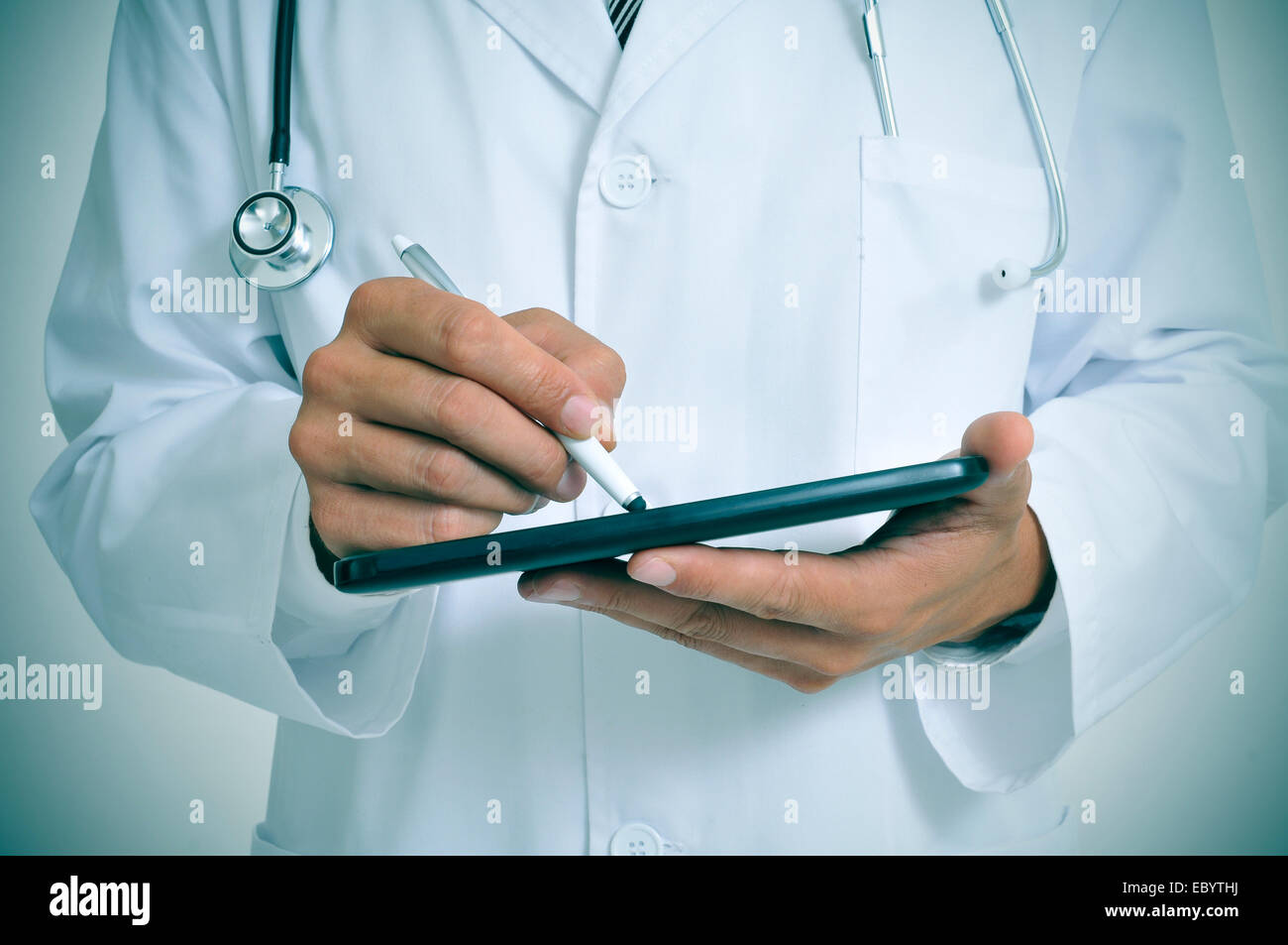 a doctor using a stylus pen in a tablet Stock Photo - Alamy