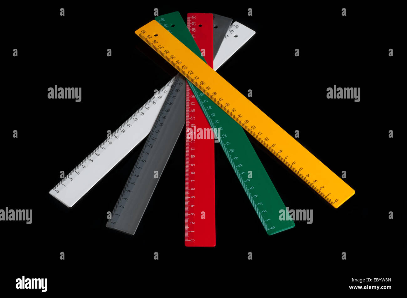 Set of colorful rulers isolated on black Stock Photo - Alamy