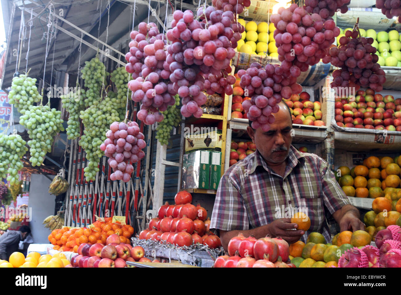 Dhaka 05 December 2014. Fruit vendor at Chwak Bazar in Old Dhaka, The capital city of Bangladesh ...