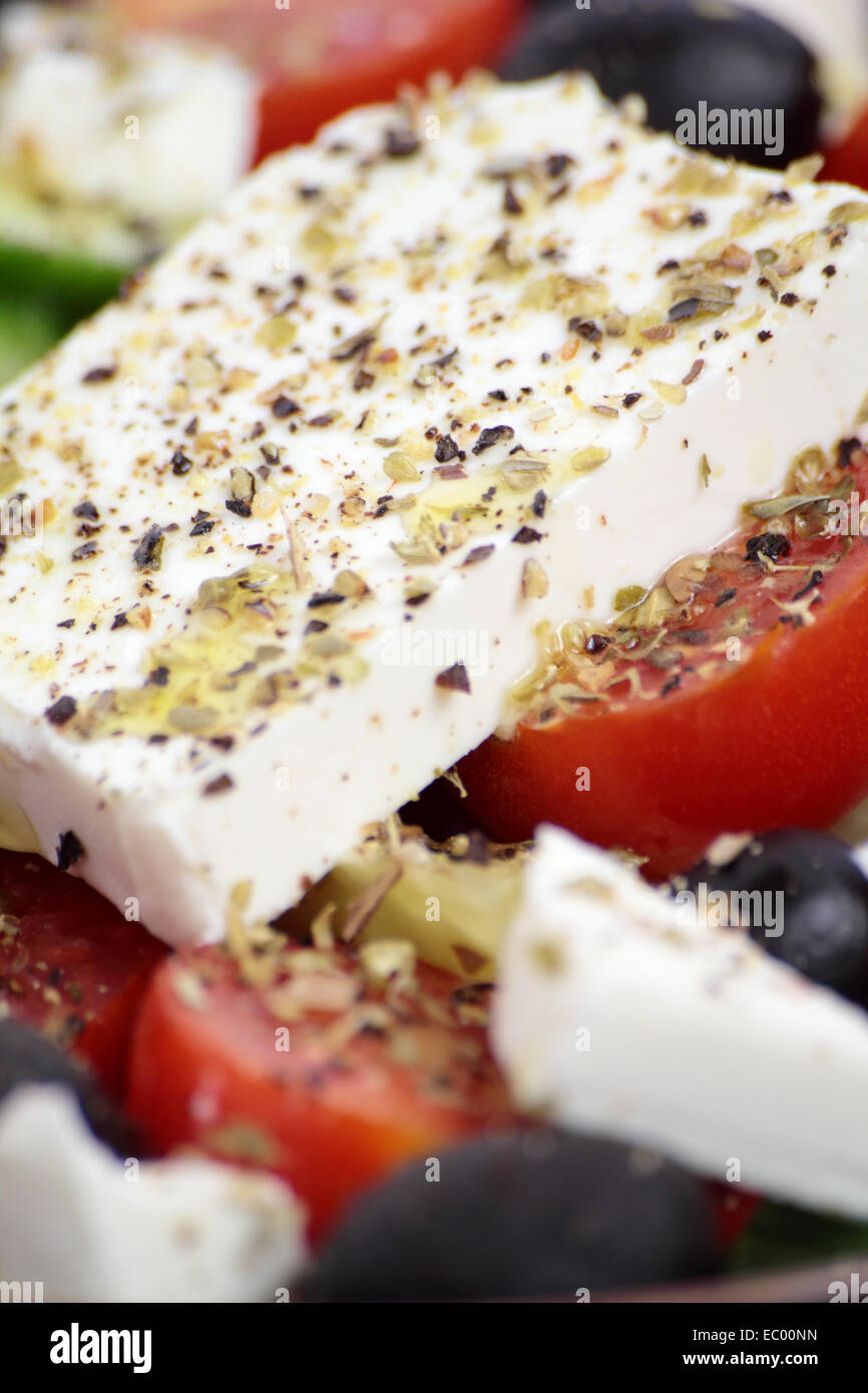 Greek salad in a deep blue bowl Stock Photo - Alamy