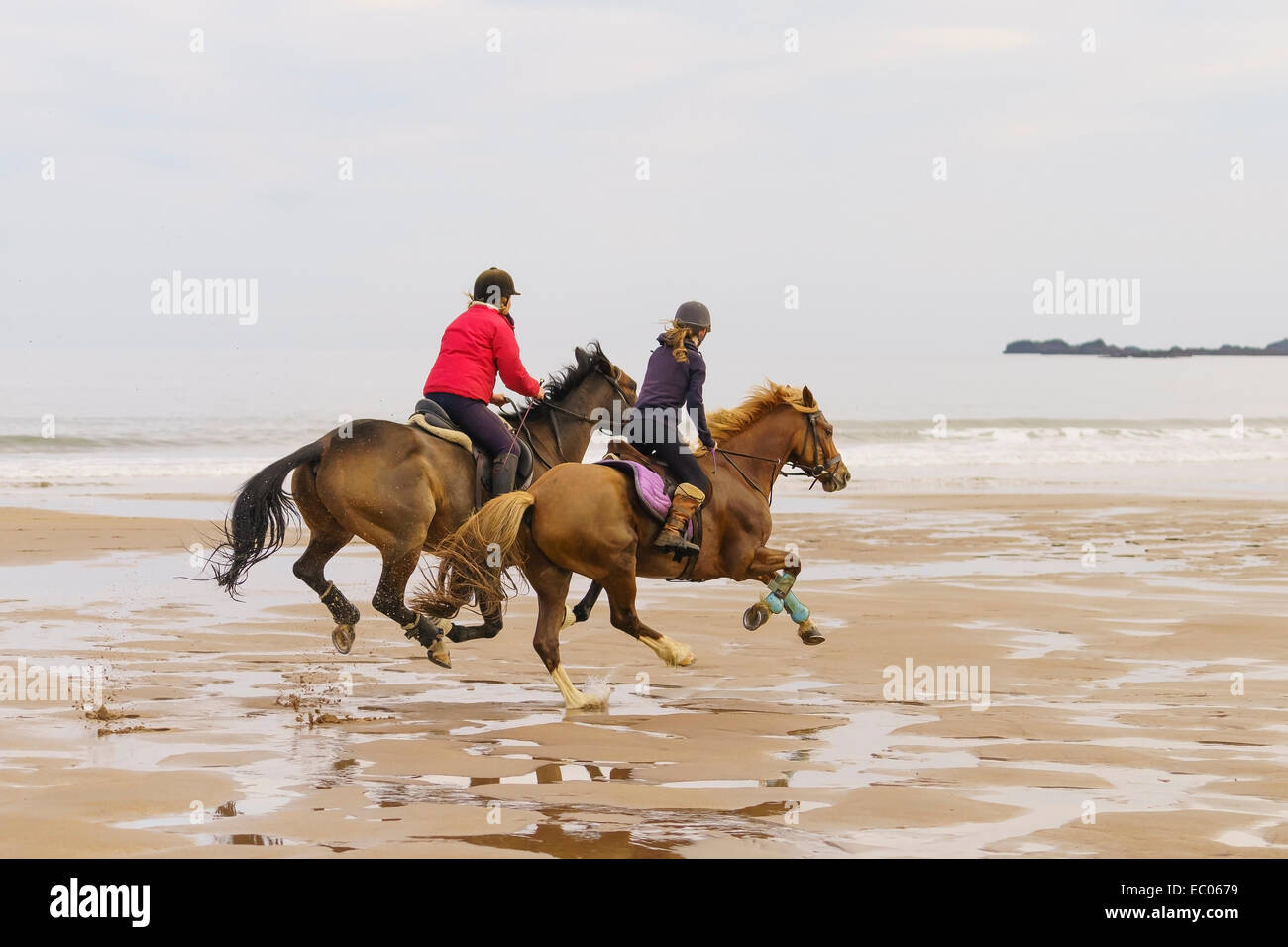 Horse riders on the beach at John Muir country park, near Dunbar, East ...