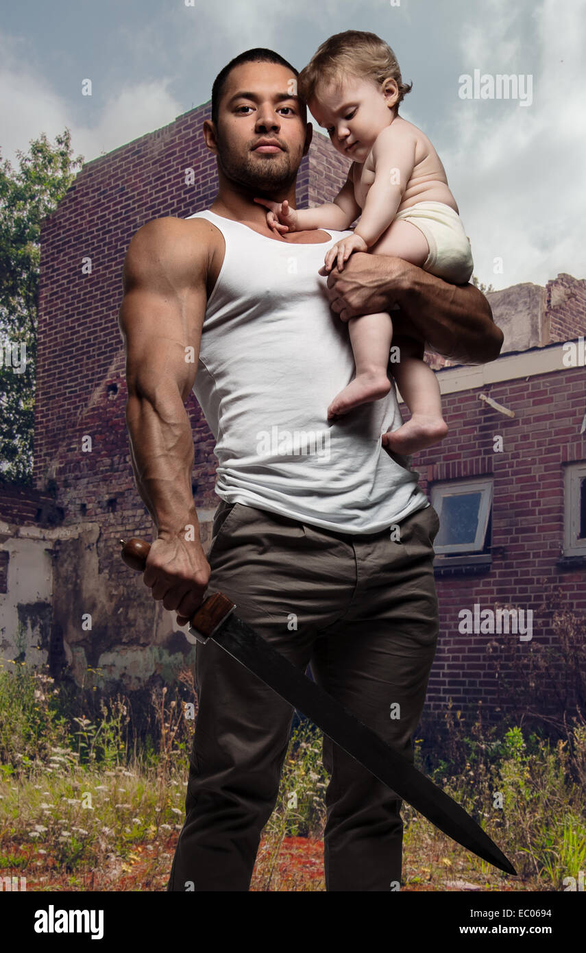 Father hugging a baby and holding a sword Stock Photo - Alamy