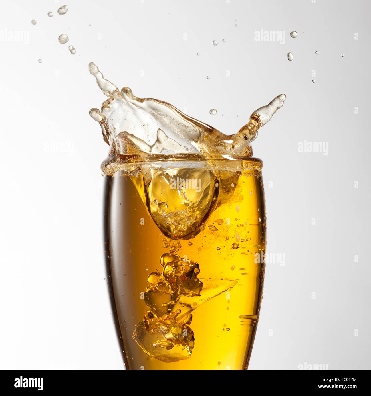 Beer splash in glass isolated on white background Stock Photo - Alamy