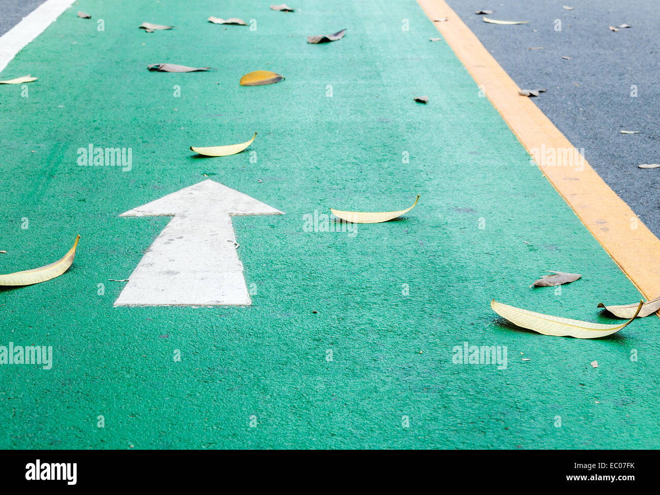Straight arrow on the running lane Stock Photo - Alamy