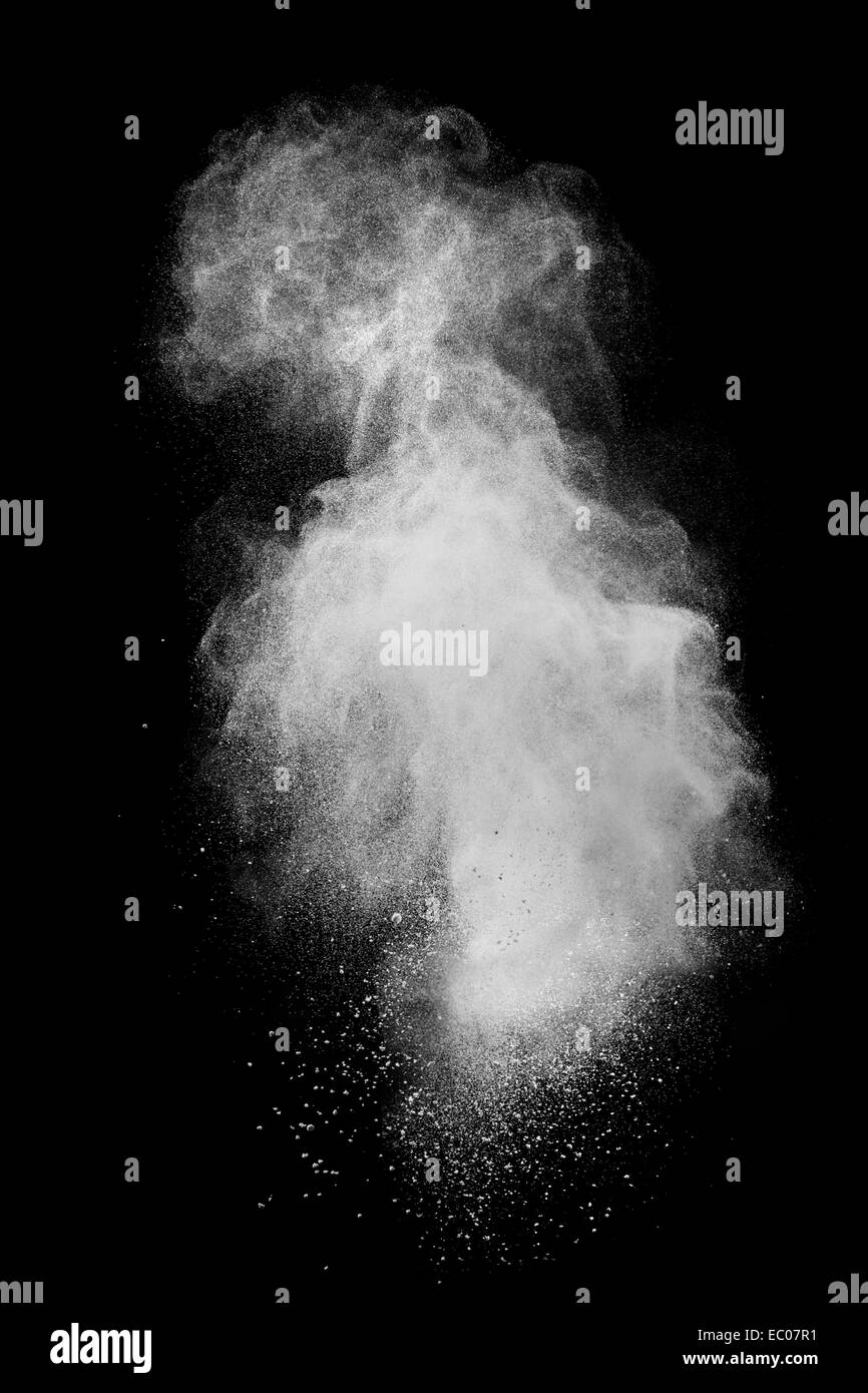 White powder explosion isolated on black background Stock Photo - Alamy