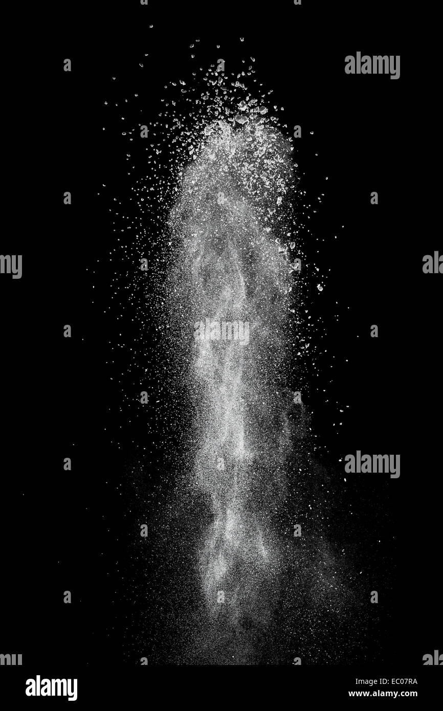 White powder explosion isolated on black background Stock Photo - Alamy