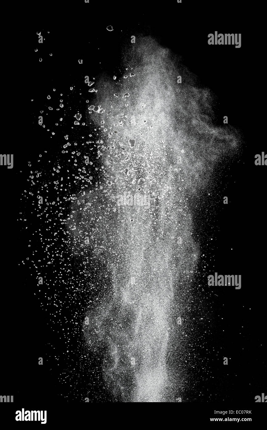 White powder explosion isolated on black background Stock Photo - Alamy