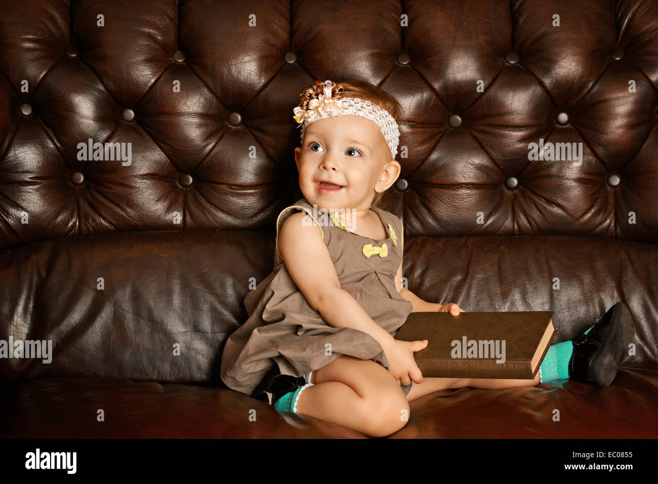 Little girl with book Stock Photo - Alamy