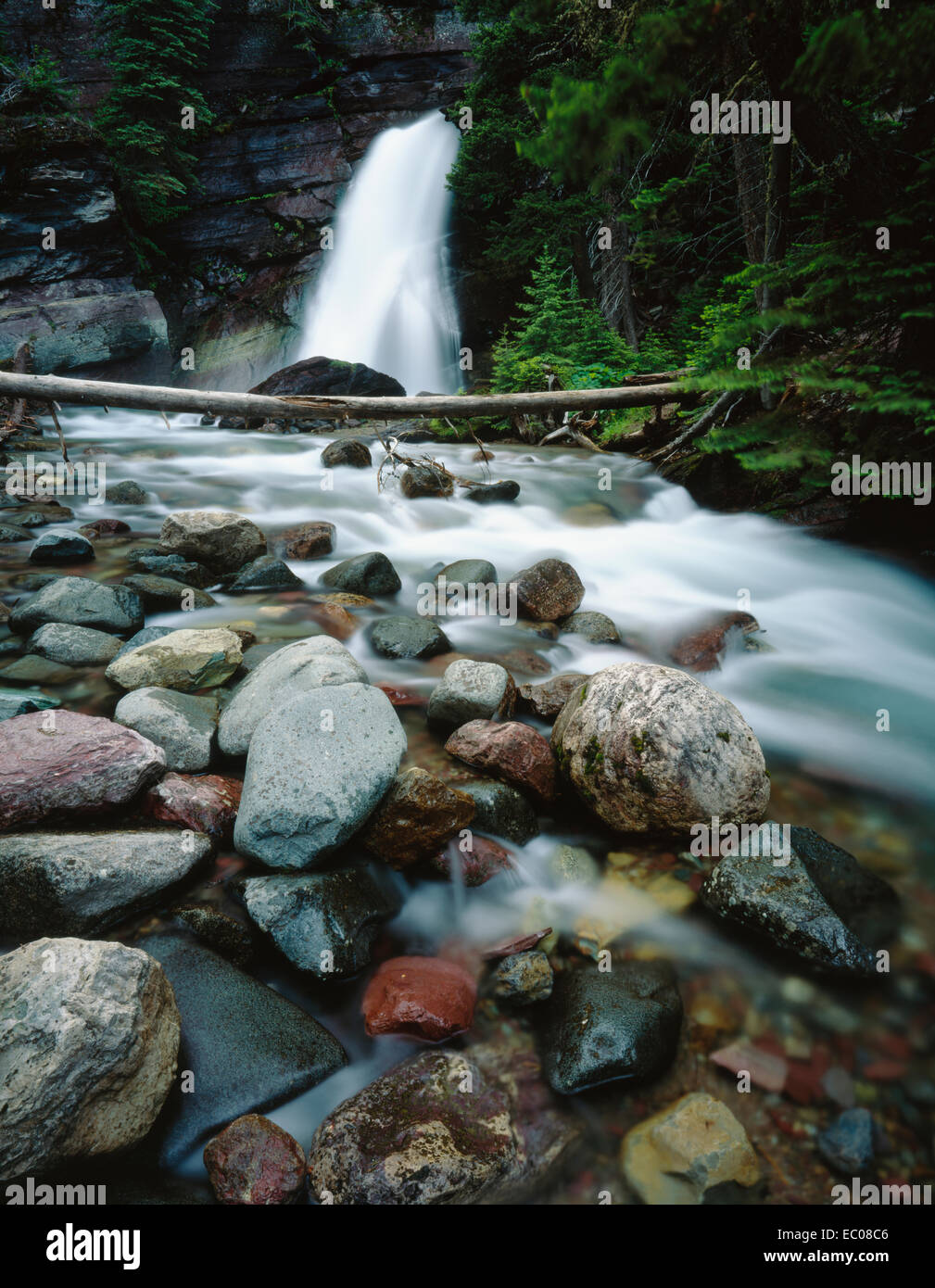 Low angle of Baring Falls with rocks in foreground. Glacier National ...