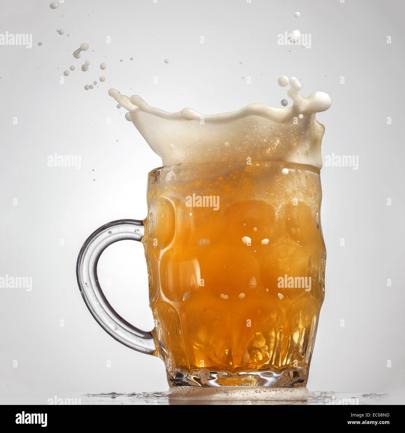 Beer splash in glass isolated on white background Stock Photo - Alamy