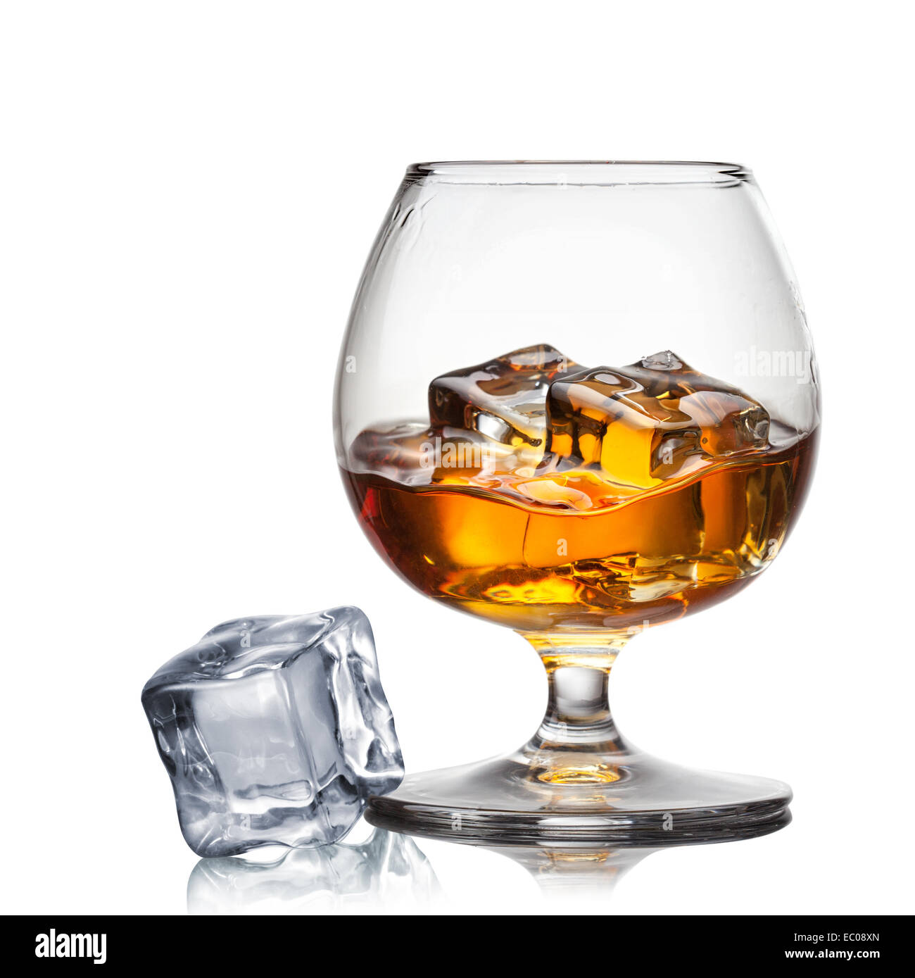 Splash of whiskey with ice in glass isolated on white background Stock ...