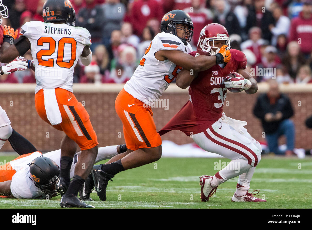 Norman, OK., US. 6th Dec, 2014. Oklahoma Sooners running back Samaje Perine (32) is taken down ...