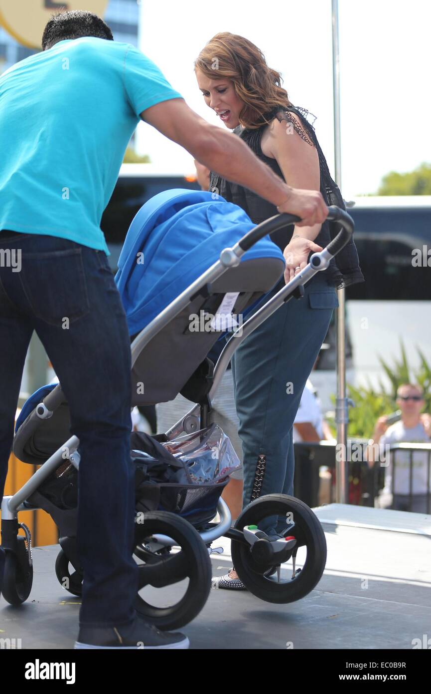 A heavily pregnant Alyssa Milano appears on Extra and receives a ...