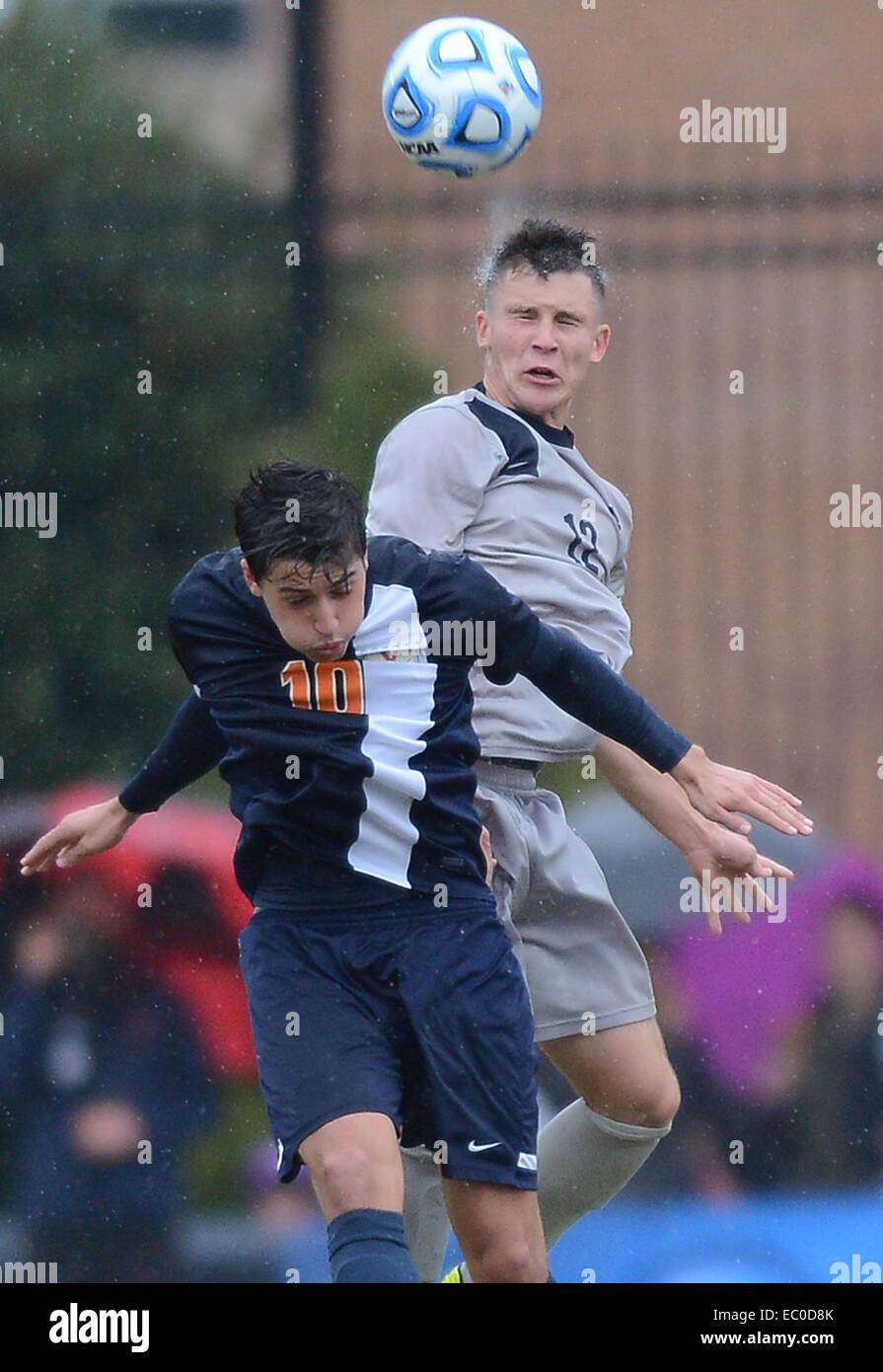 Washington, DC, USA. 6th Dec, 2014. 20141206 - Georgetown defender Keegan Rosenberry (12) wins a ...