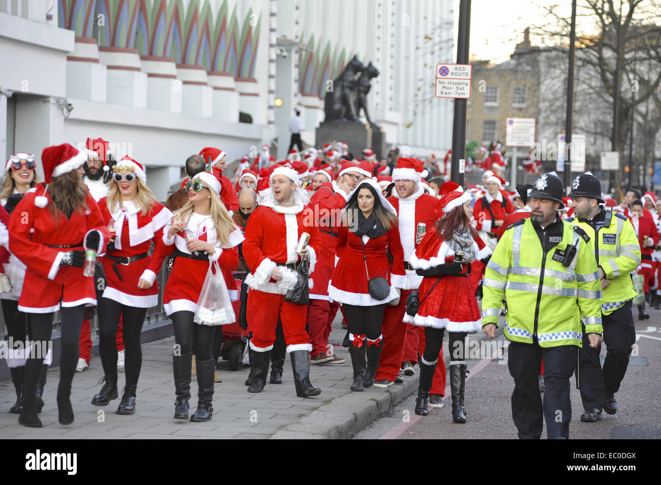 London, UK. 6th Dec, 2014. People dressed as Santa Clause at the annual ...
