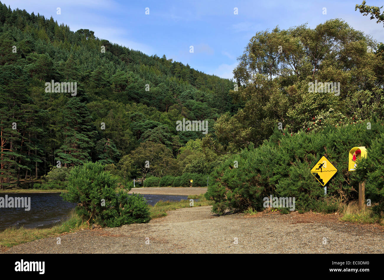 Lifebuoy and warning sign on the lake Stock Photo - Alamy