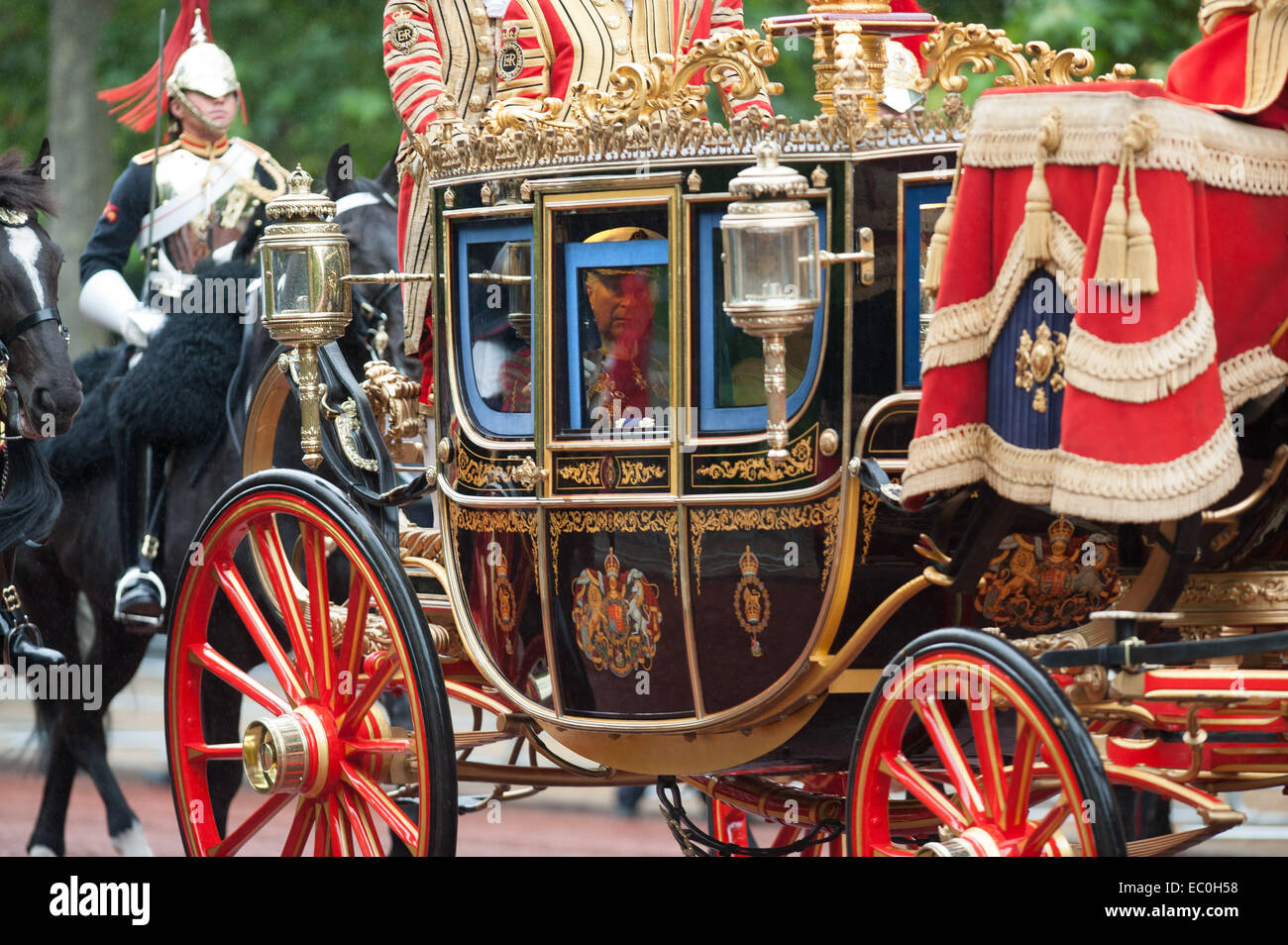 Queen Elizabeth II is driven through the Mall on her way to attend the ...