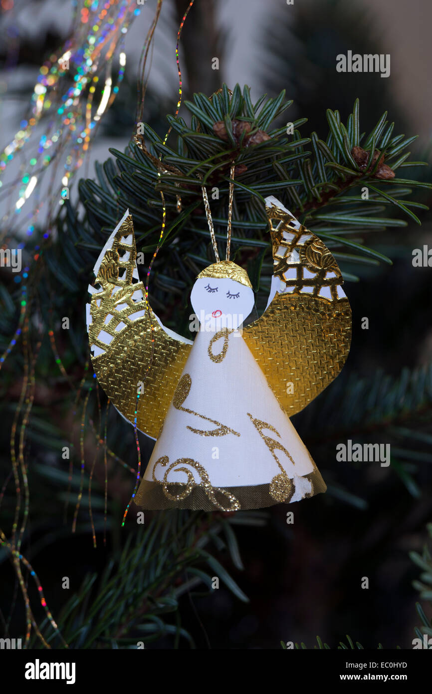 Angel and tree hi-res stock photography and images - Alamy
