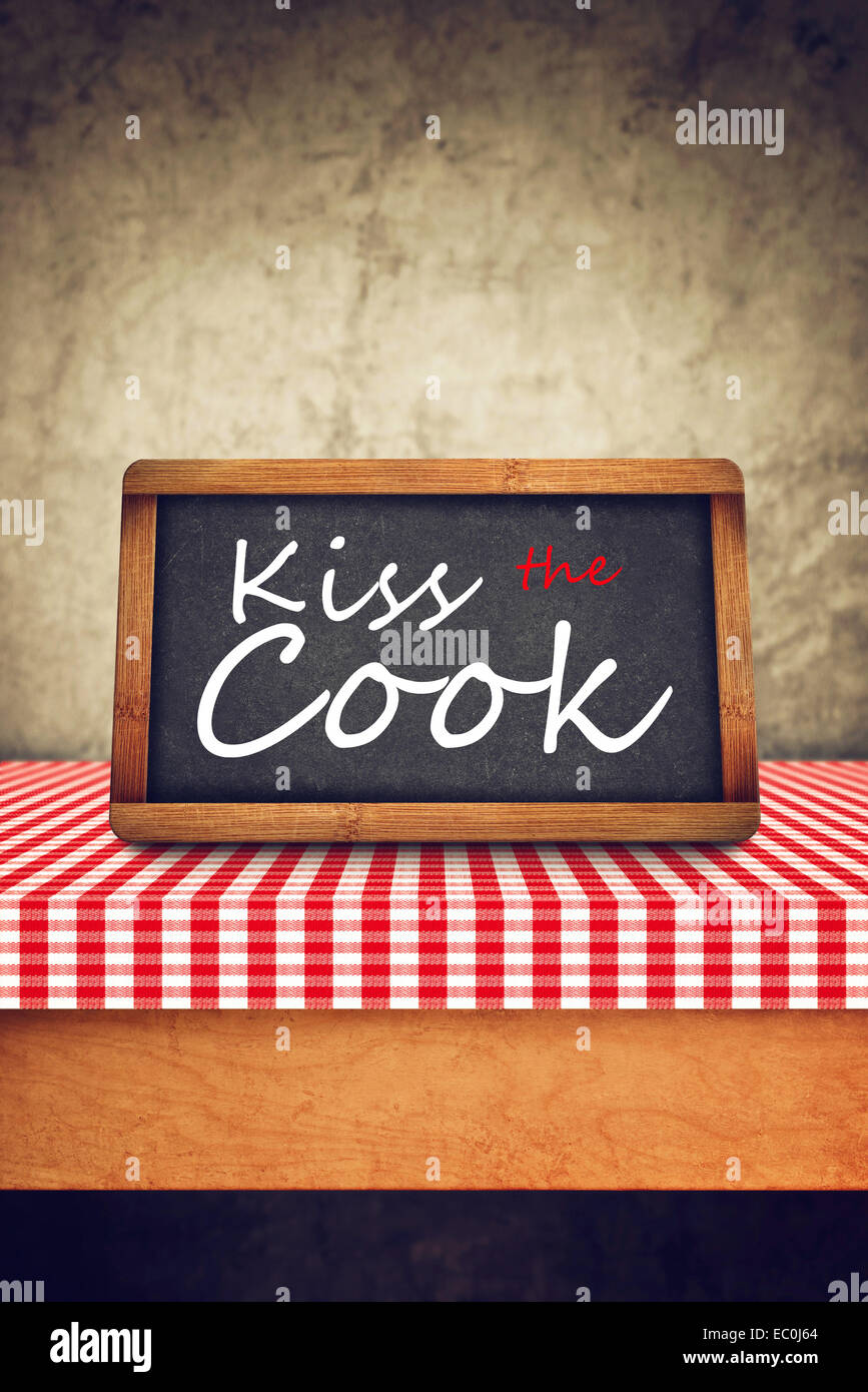 Kiss The Cook Title in white chalk on Restaurant Blackboard. Food and ...