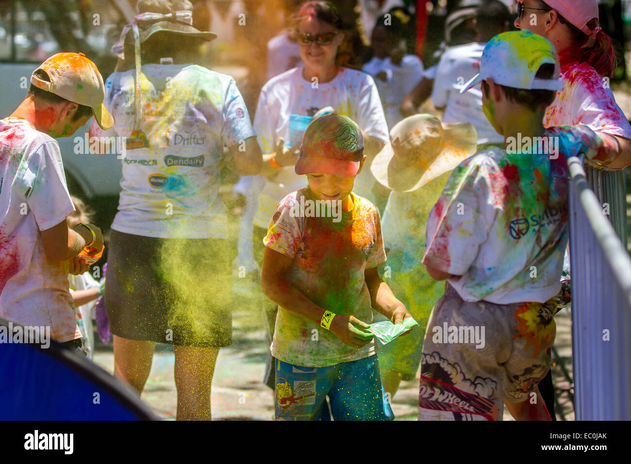 Harare. 7th Dec, 2014. People splash paints onto each other during the ...