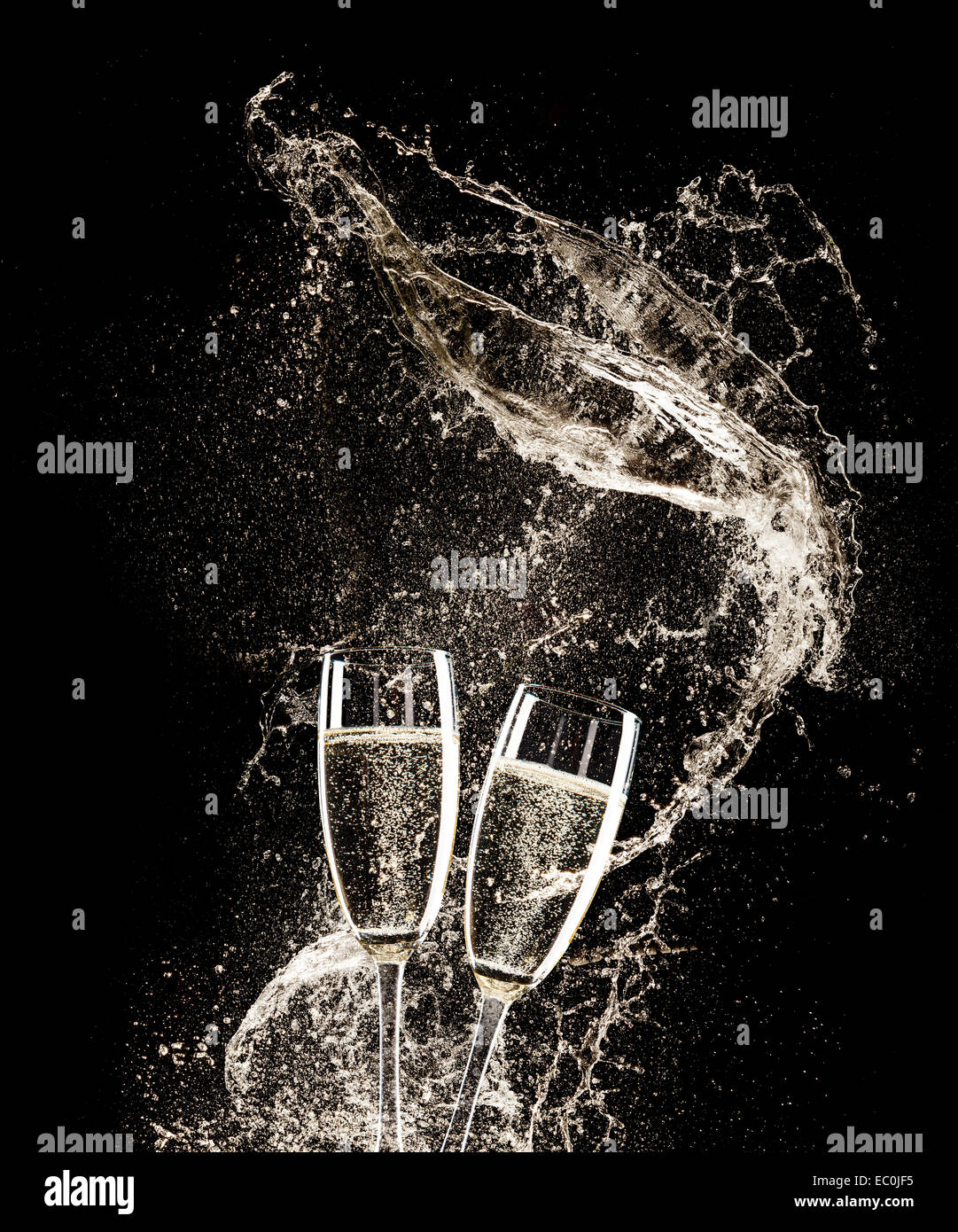 Glasses of champagne with splash, isolated on black background Stock ...