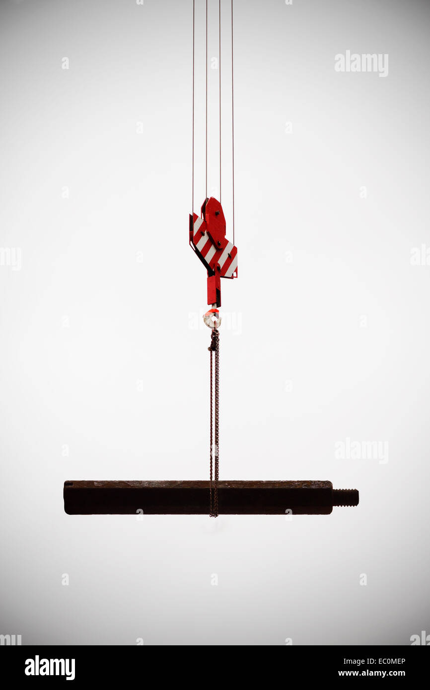 A metal rod hanging from a crane Stock Photo - Alamy