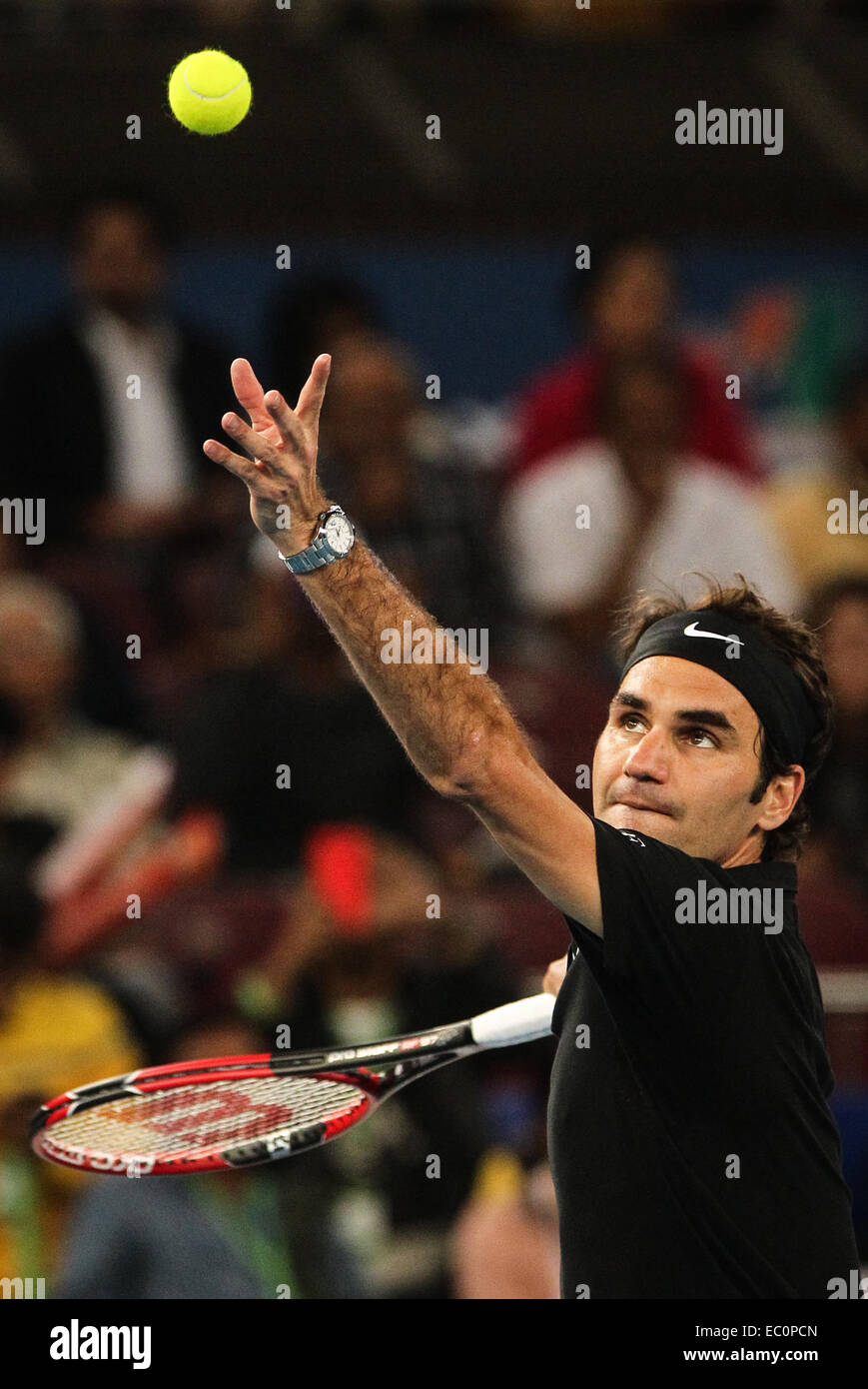 New Delhi, India. 7th Dec, 2014. Roger Federer of Indian Aces serves a ...