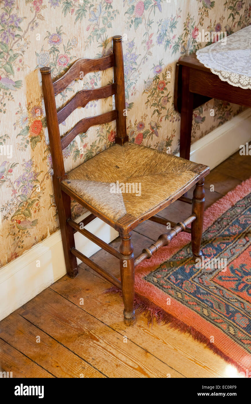Single chair in a room Stock Photo - Alamy