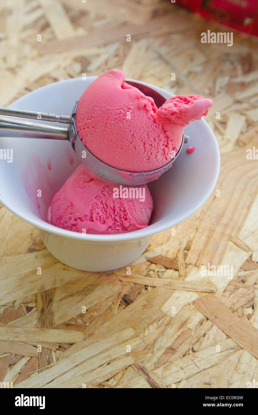Red berries ice cream and an ice cream spoon Stock Photo - Alamy