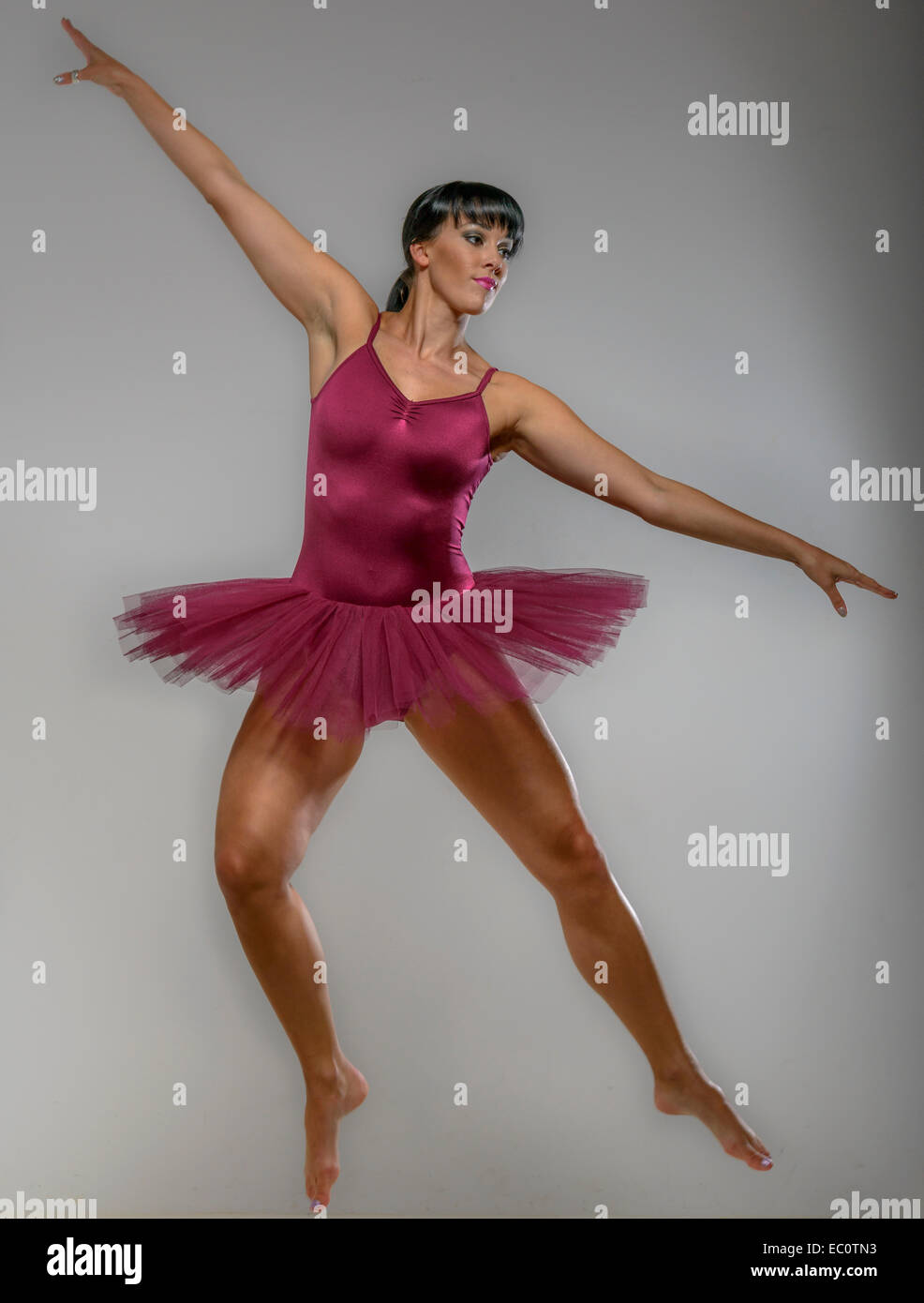 Ballet Dancer jumping high against a white background Stock Photo - Alamy