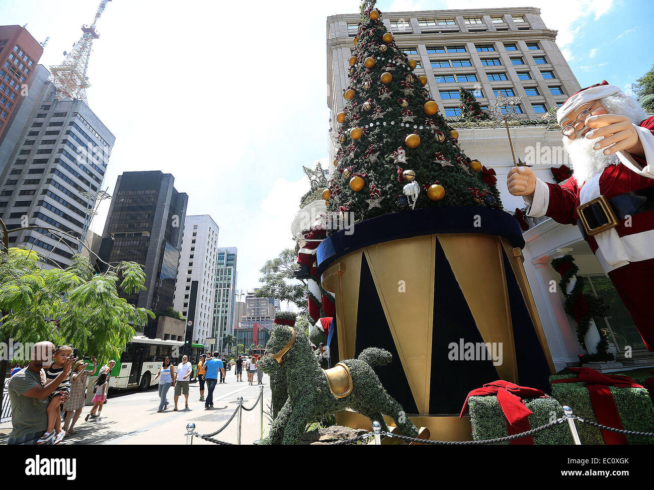 Sao Paulo, Brazil. 7th Dec, 2014. A man takes pictures of a Santa Claus ...