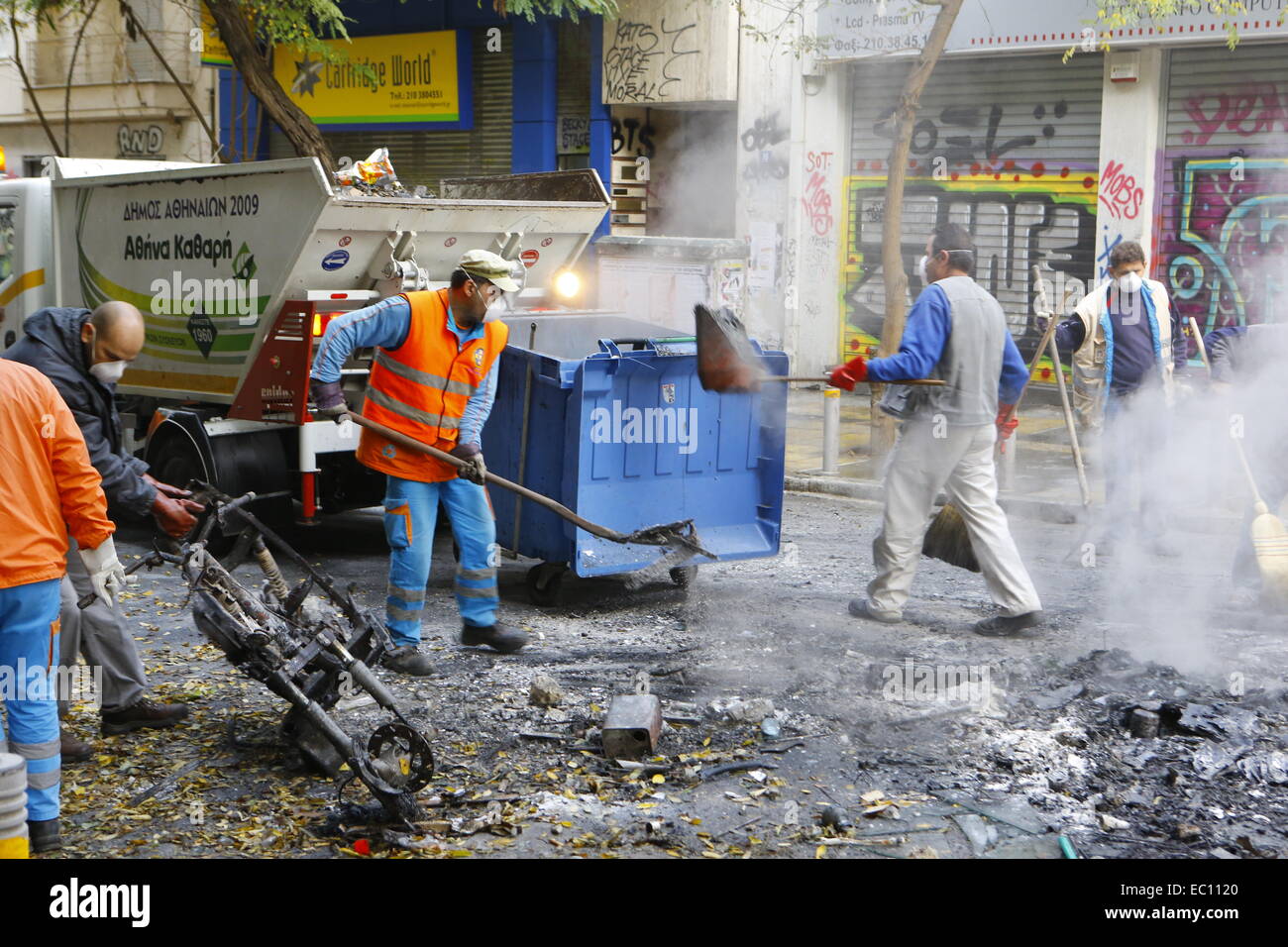 Exarchi, Greece. 7th Dec, 2014. People clean up the neighborhood of ...