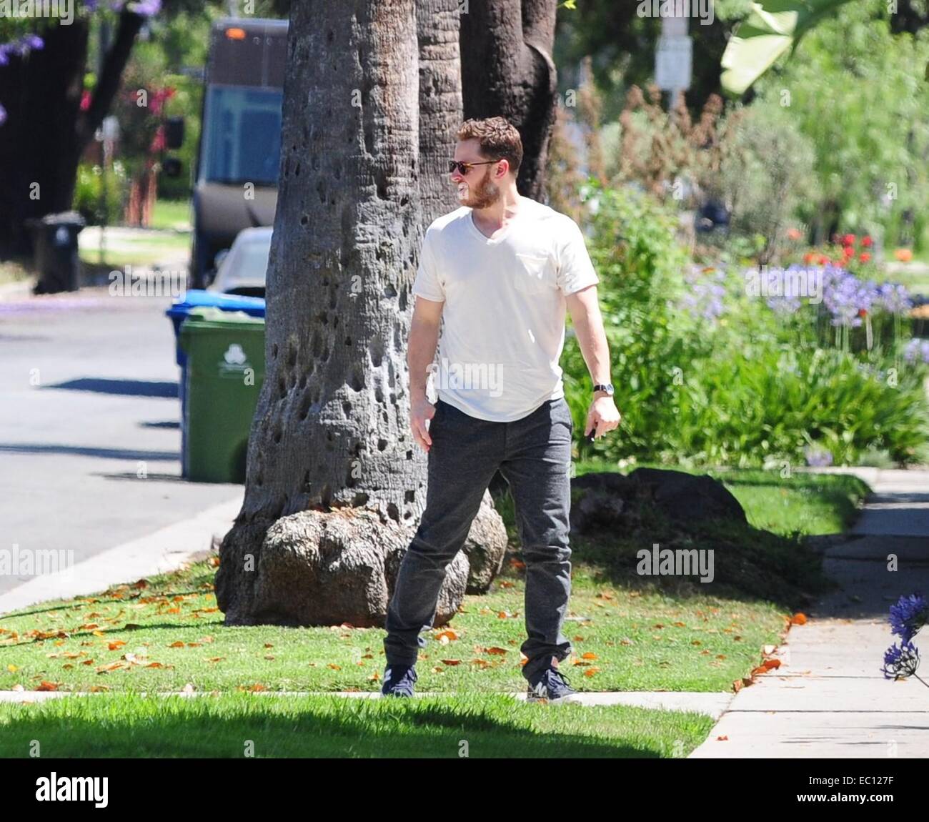 Josh Dallas holds hands with an elderly female companion while out and ...
