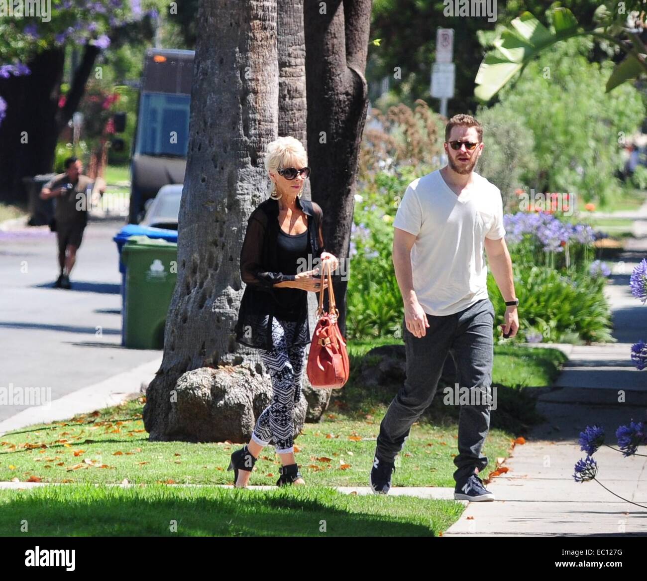 Josh Dallas holds hands with an elderly female companion while out and ...