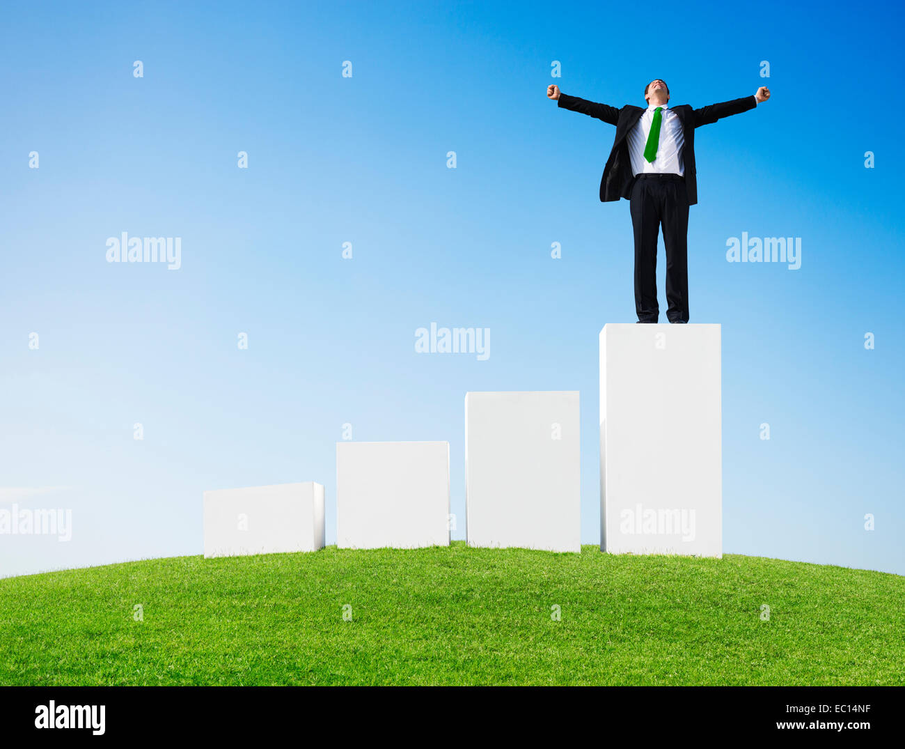 Business Man Outdoors Standing on a Bar Graph with Arms Raised Stock ...