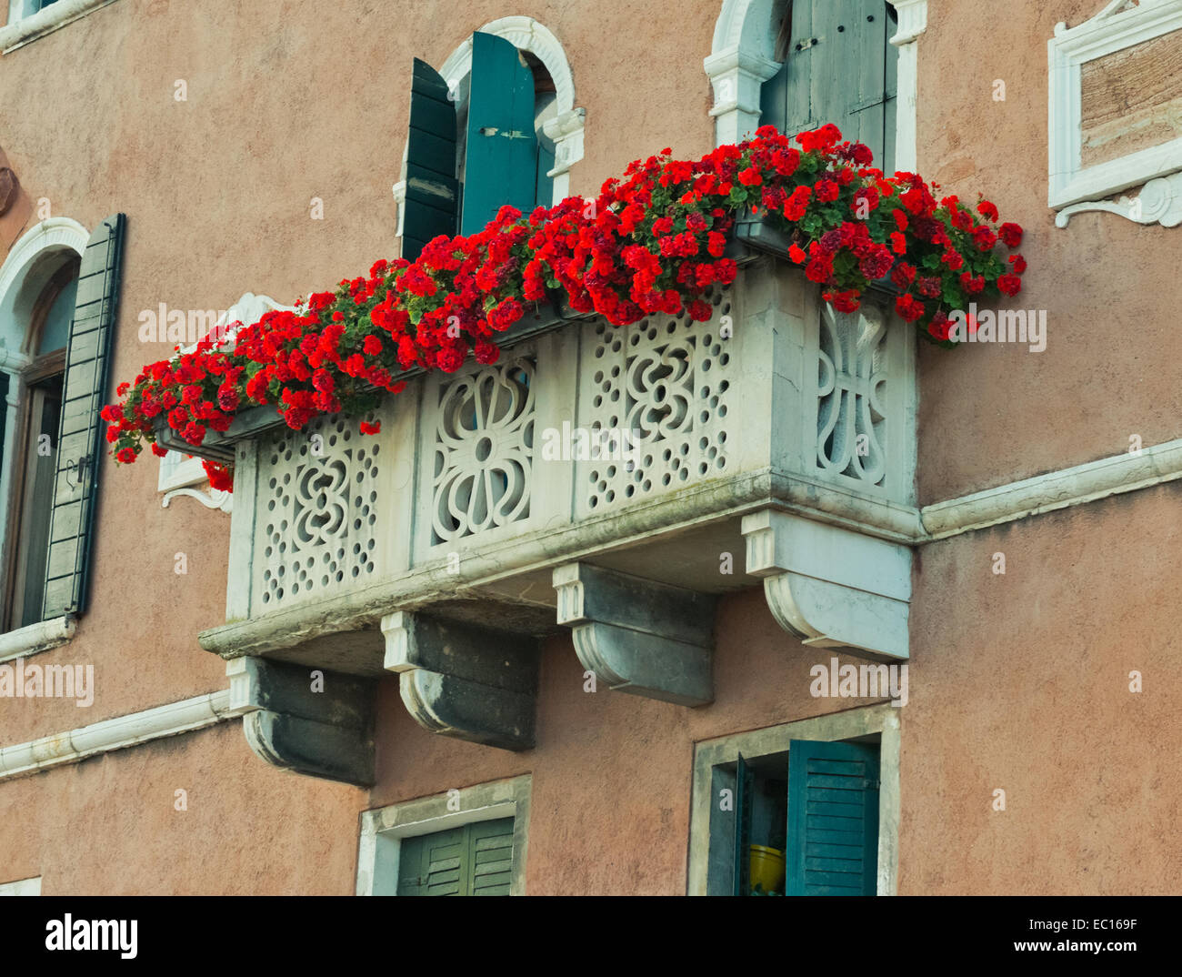 Arched window with balcony and flowers in Venice, Italy Stock Photo - Alamy