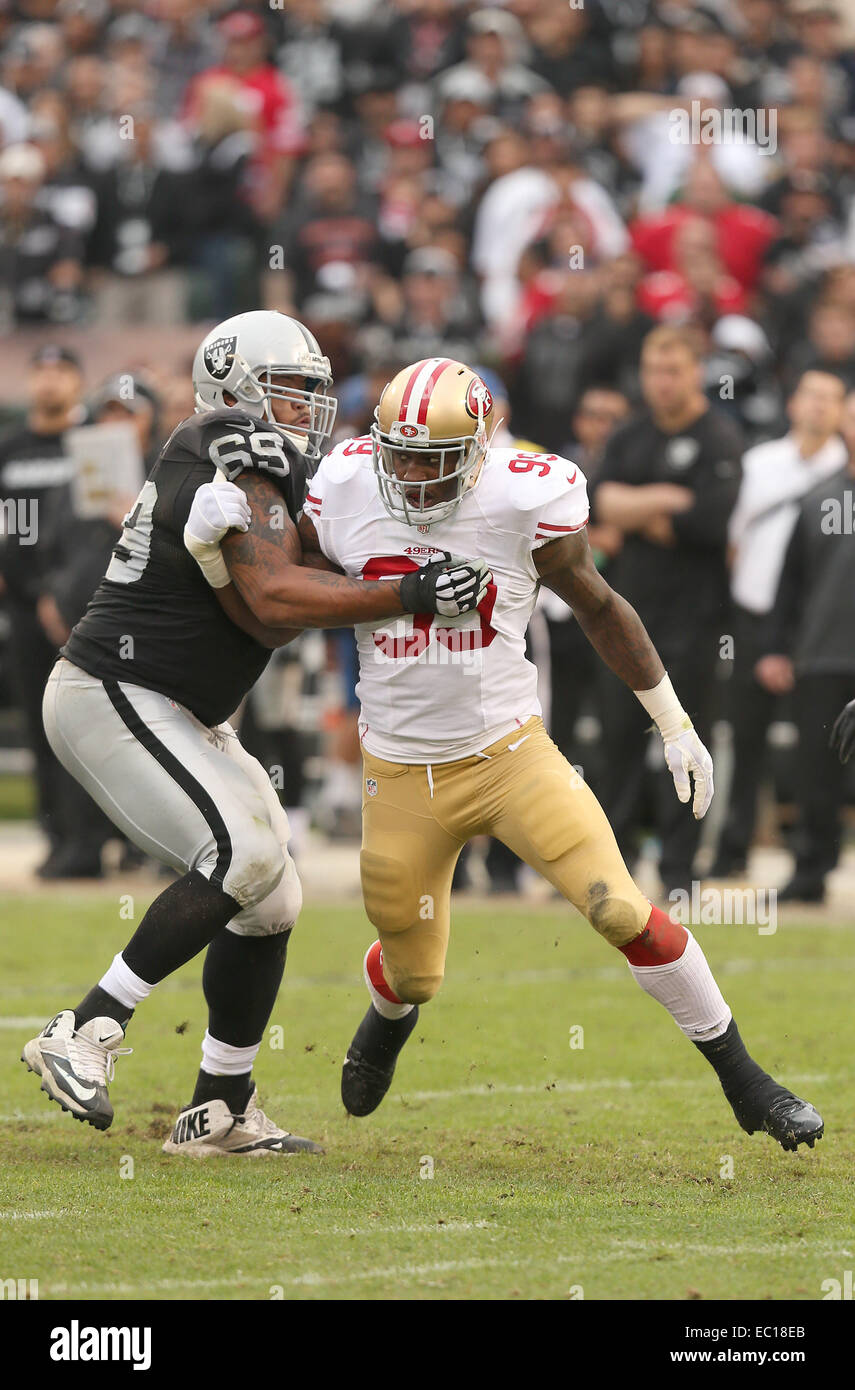 Oakland, CA. 07th Dec, 2014. Raiders guard Khalif Barnes tries to ...