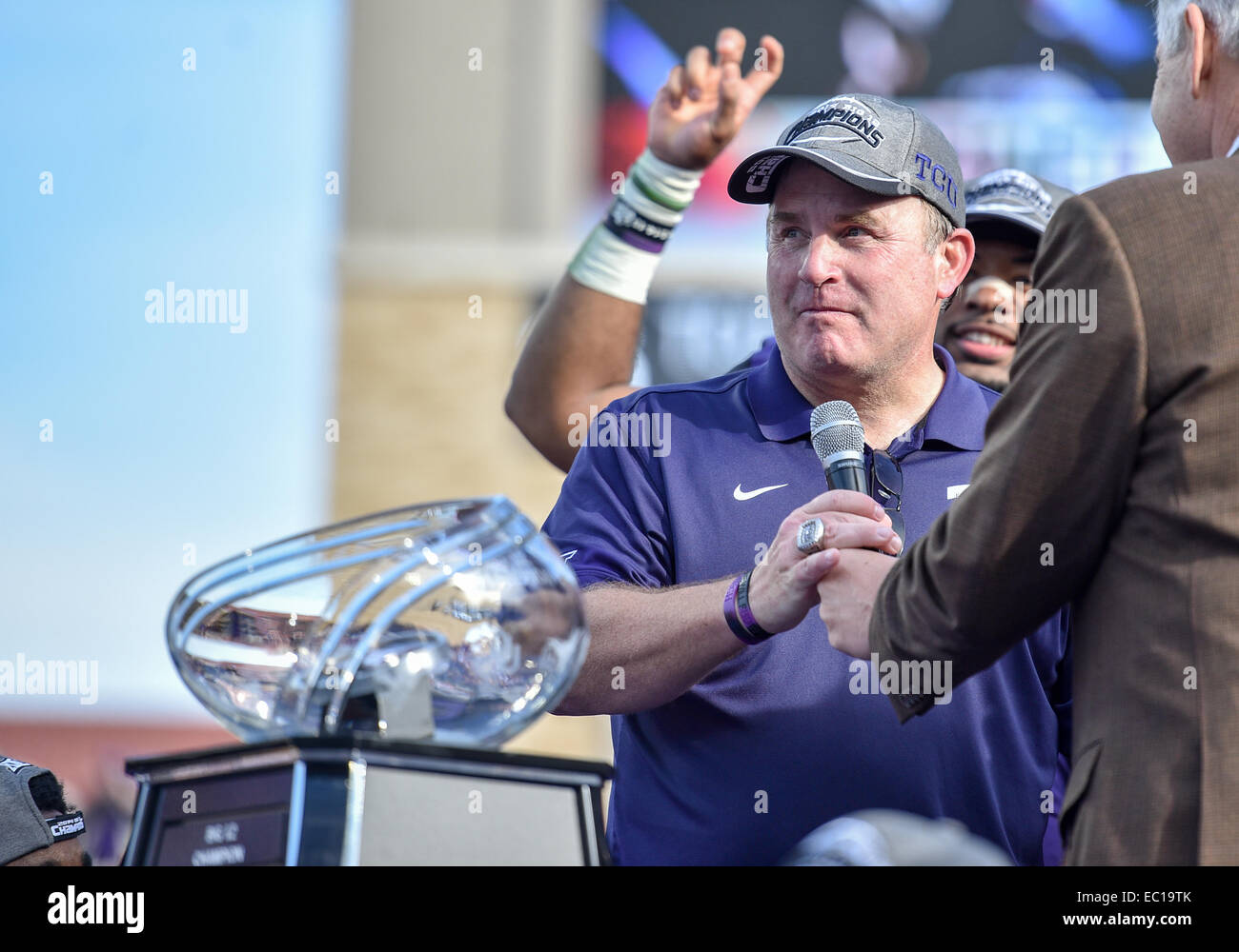 TCU players celebrate and pose with the Big-12 trophy after an NCAA ...