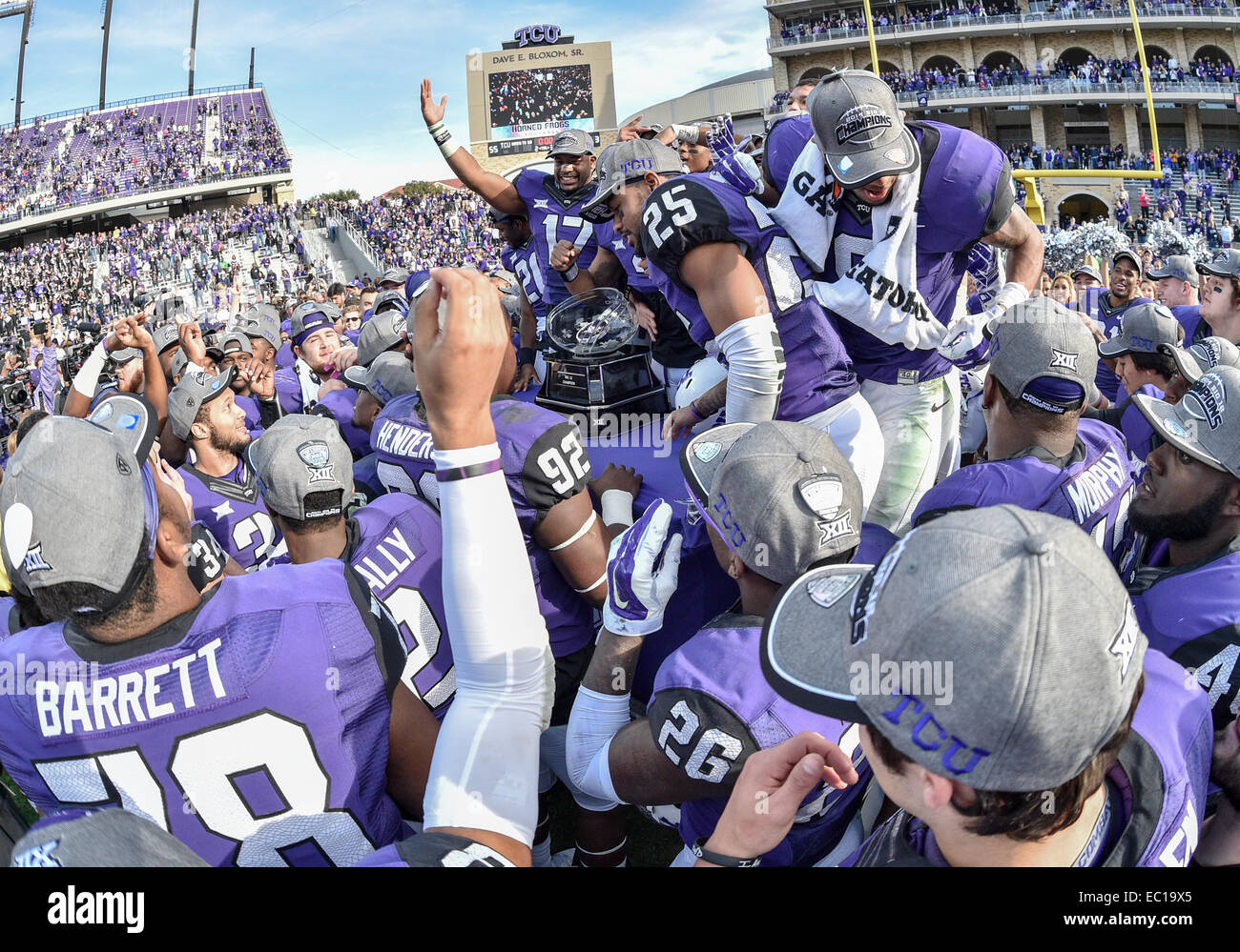TCU players celebrate and pose with the Big-12 trophy after an NCAA ...