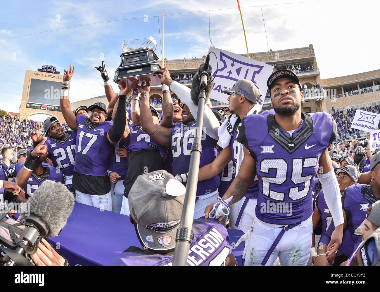 TCU players celebrate and pose with the Big-12 trophy after an NCAA ...
